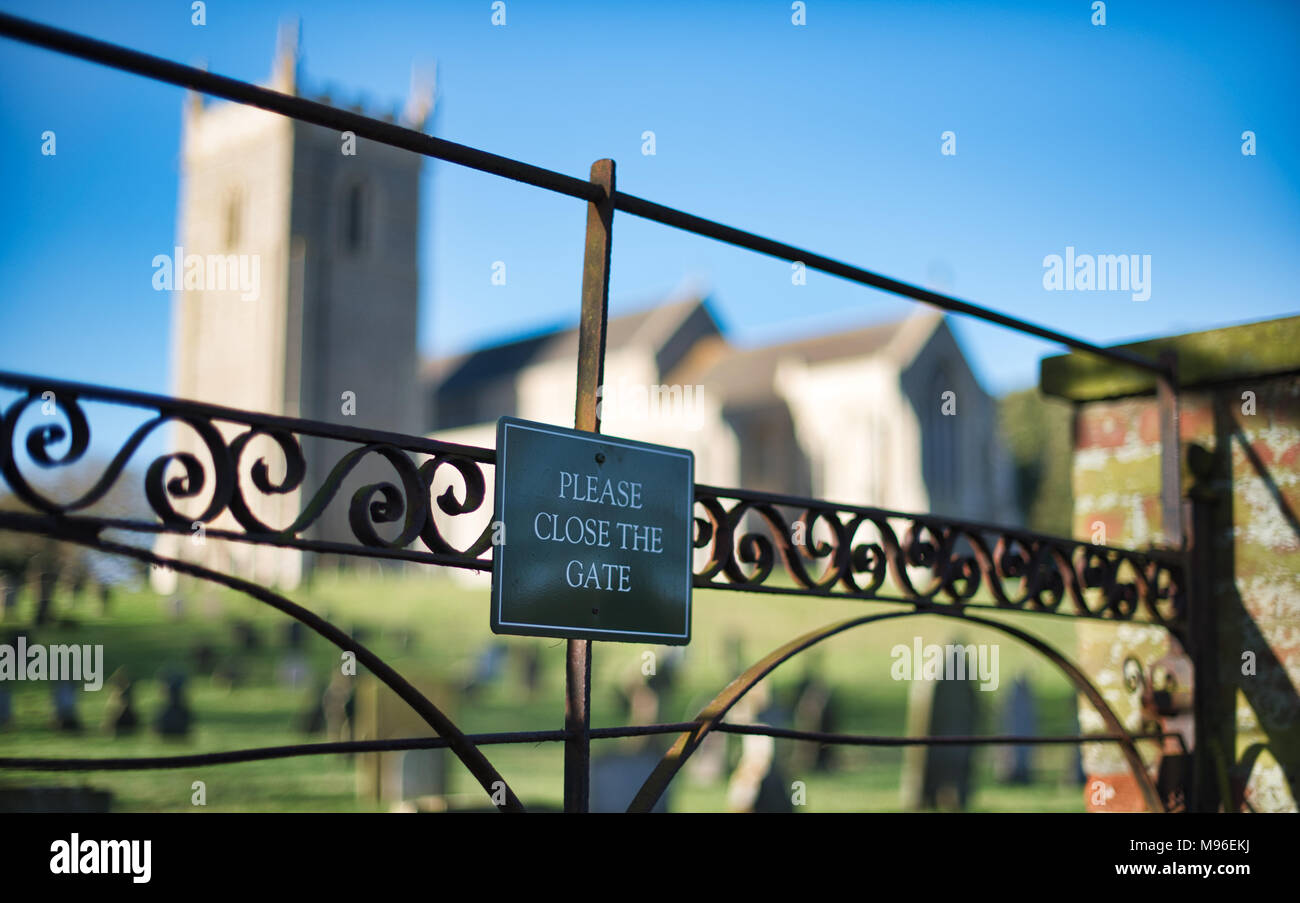 church gate with church in background Stock Photo - Alamy