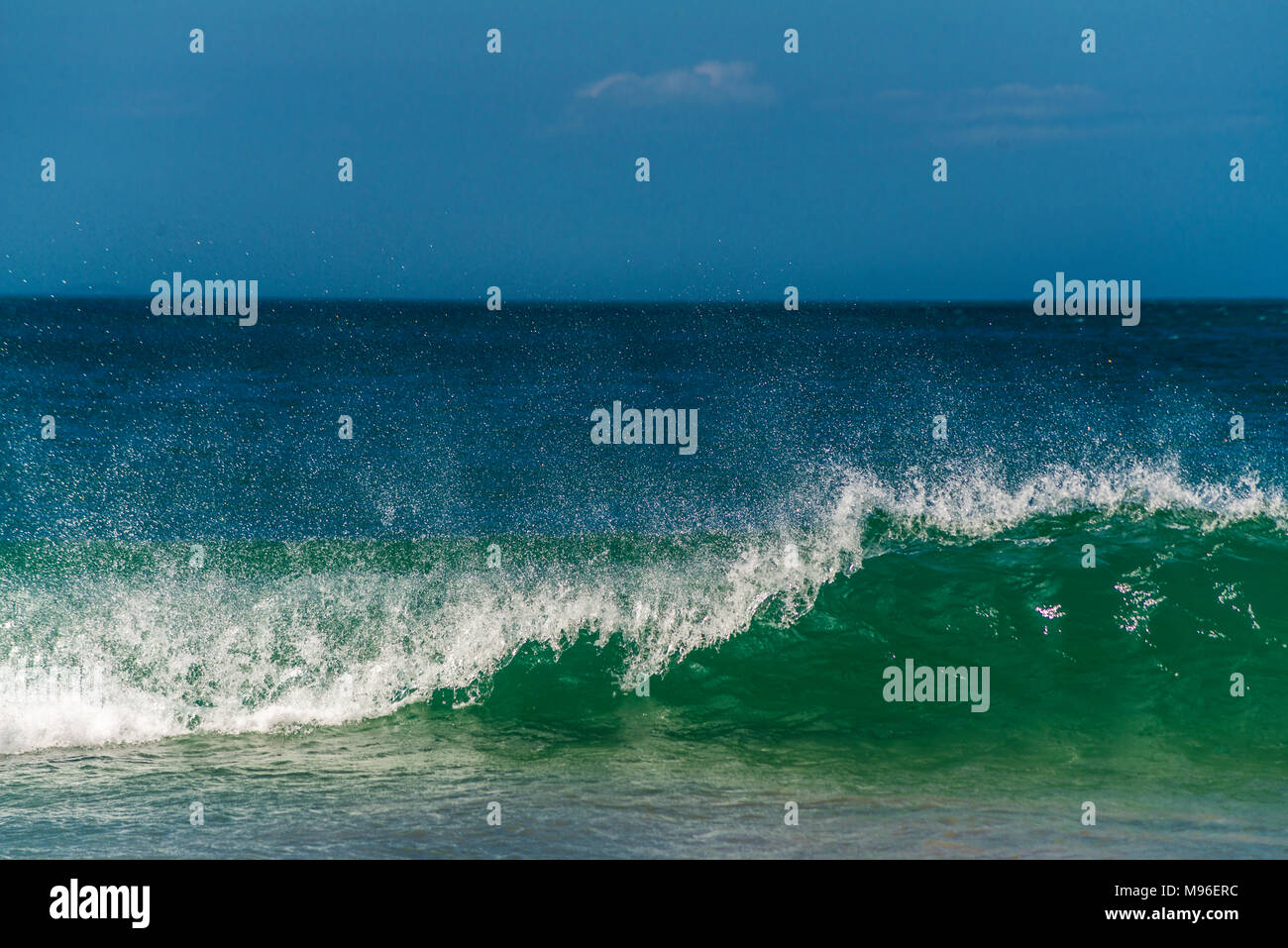 wave front view splashing with blue and green sea and blue sky Stock ...