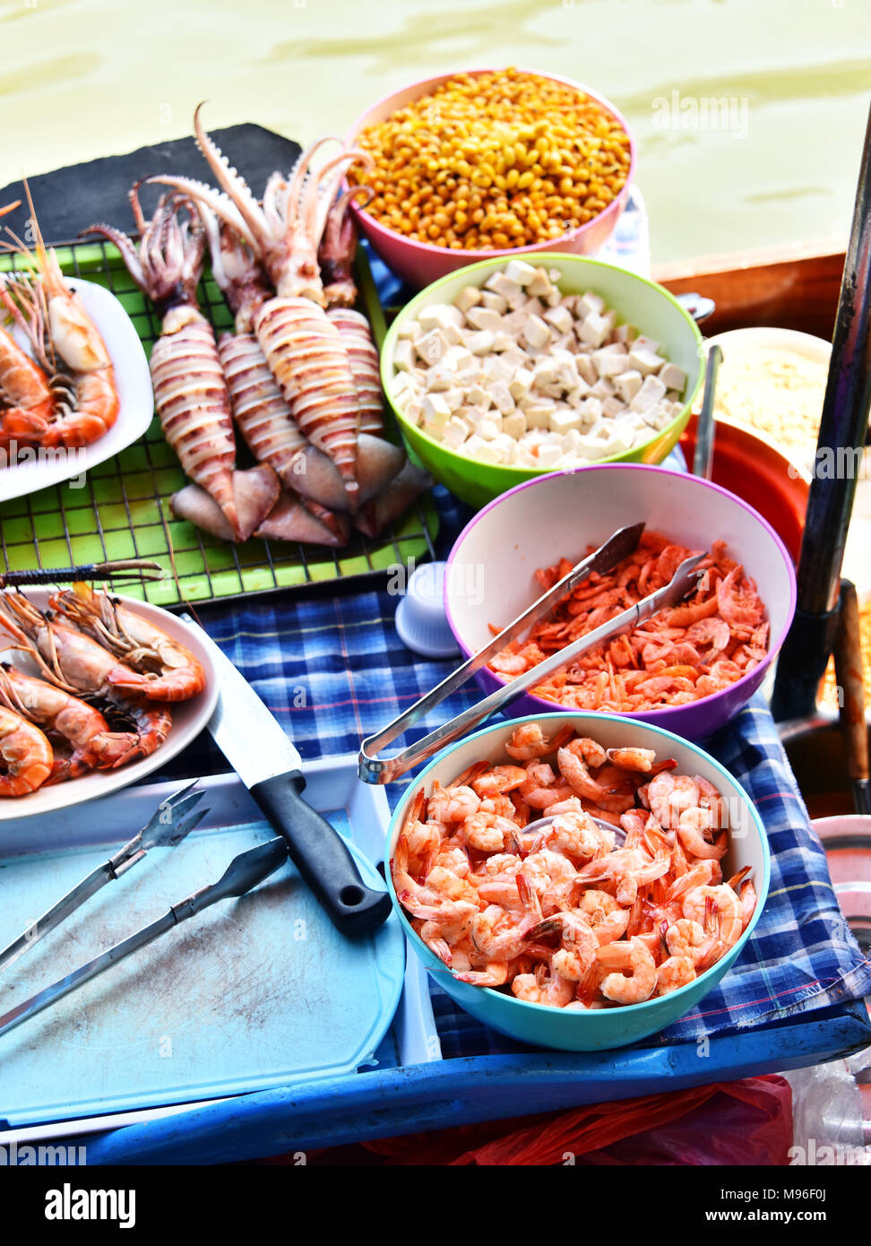Preparing seafood in the street restaurant on boat in Thailand Stock ...