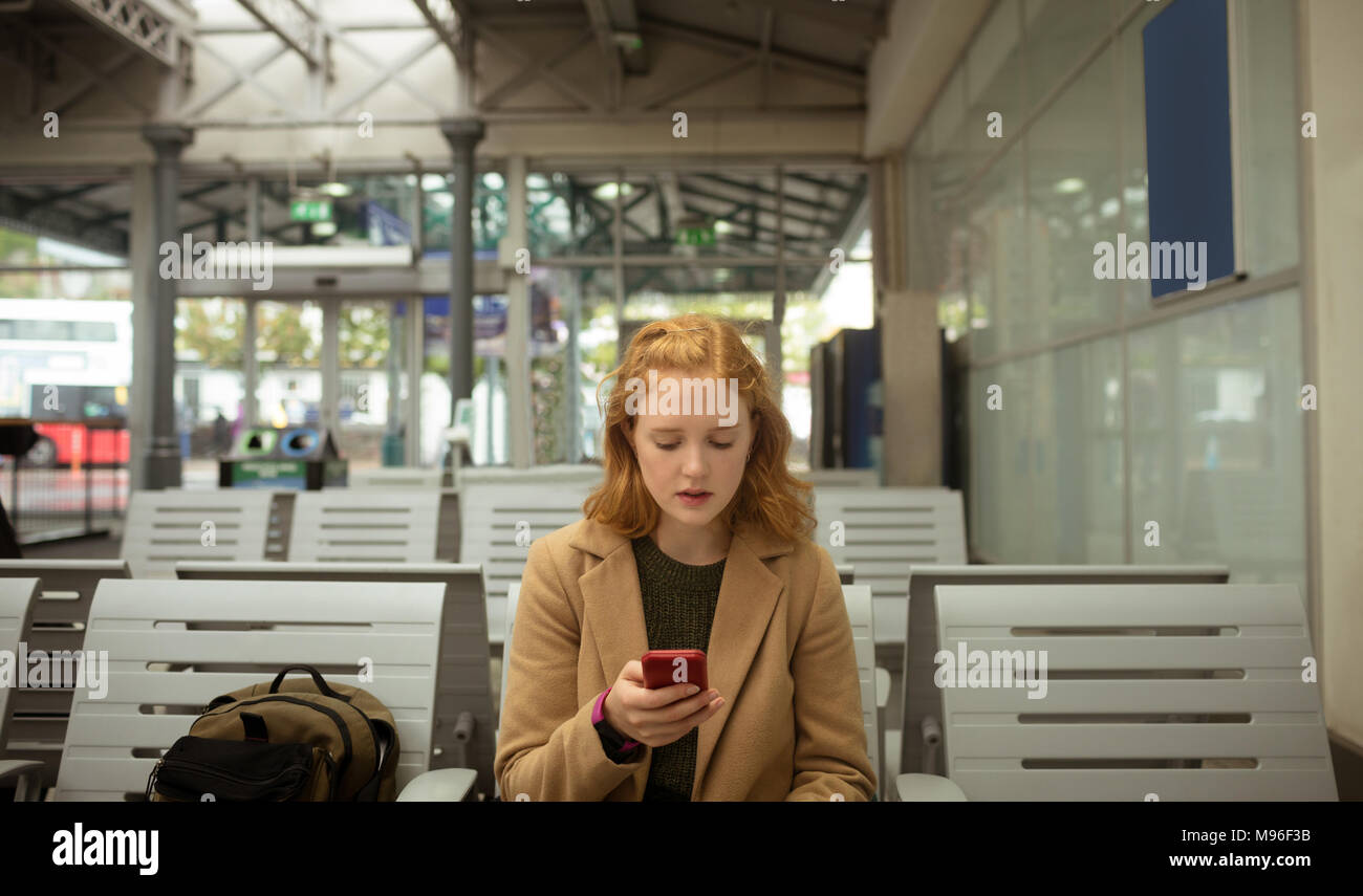 Mobile phone bus stop woman hi-res stock photography and images - Alamy