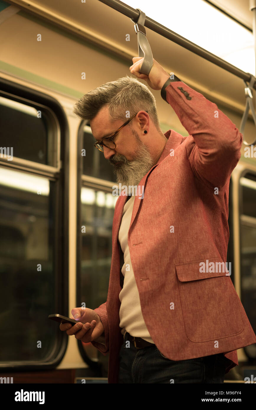 Man standing using mobile phone Stock Photo - Alamy