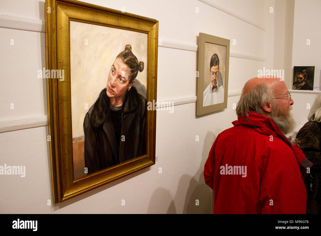 People socialise at a private view of portrait paintings Stock Photo ...