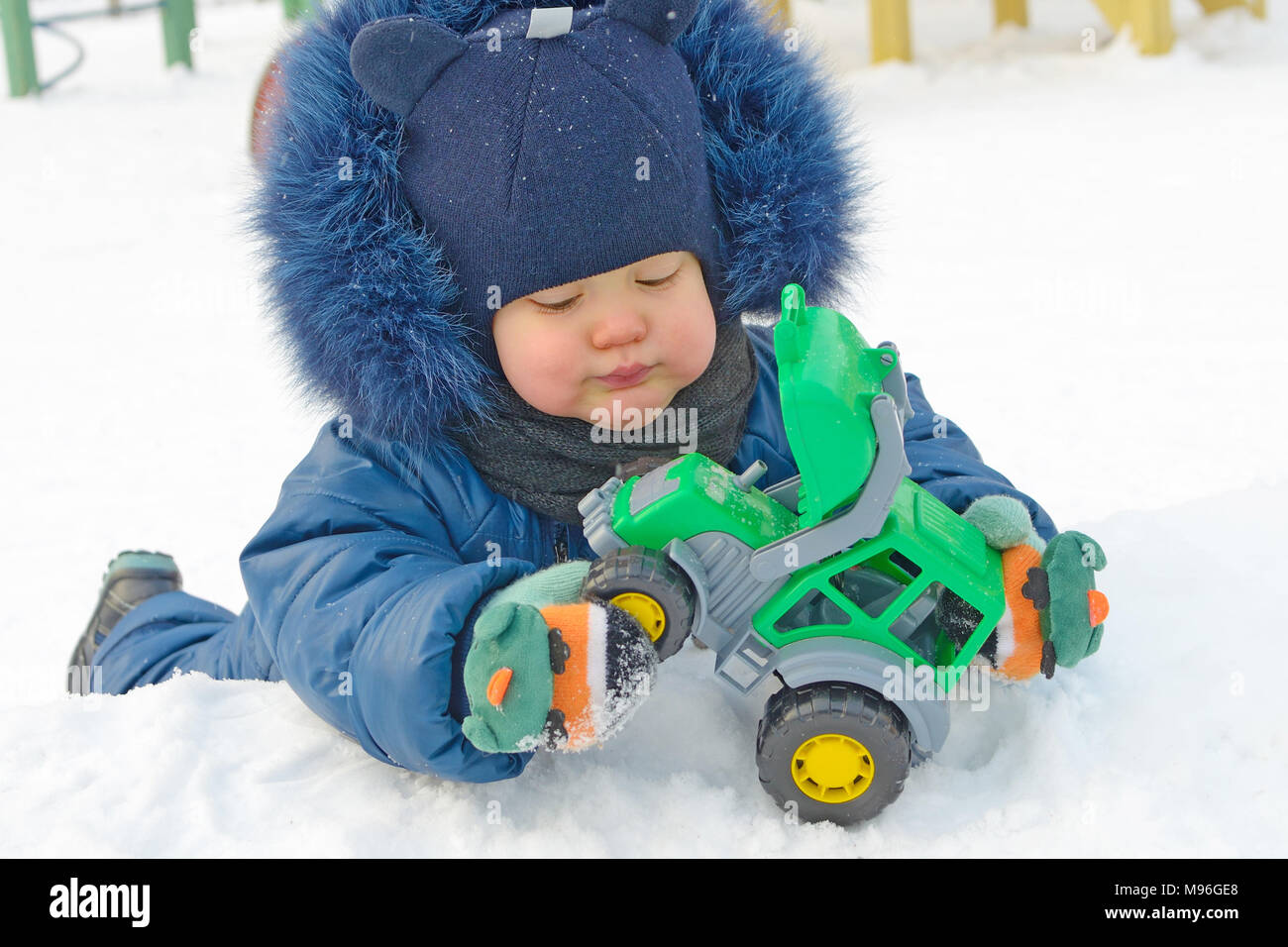 A child plays on the Playground.Very cheerful and playful kid Stock ...