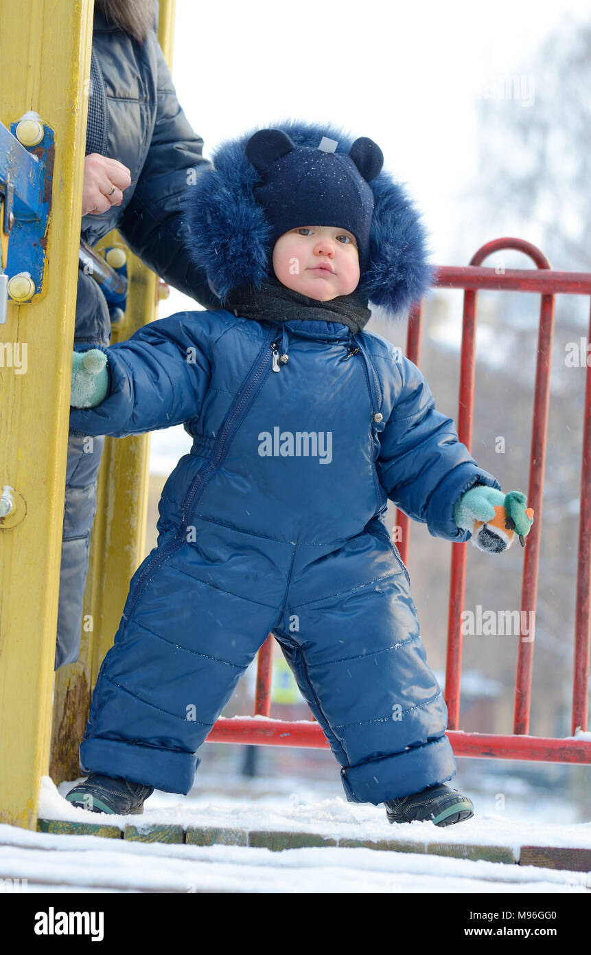 A child plays on the Playground.Very cheerful and playful kid Stock ...