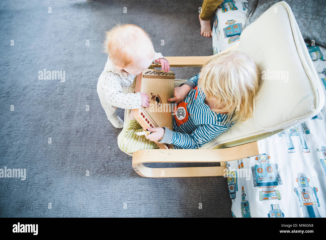 Child playing harp hi-res stock photography and images - Alamy