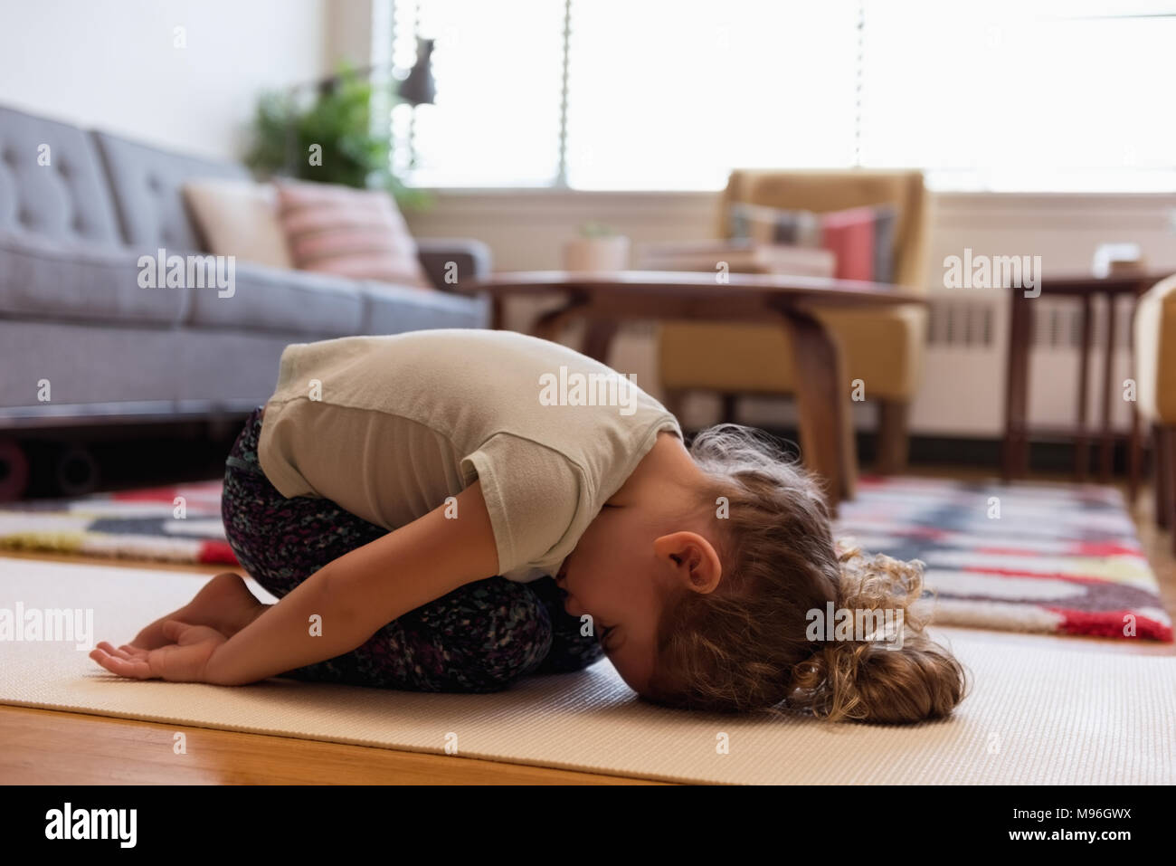 Girl doing yoga meditation in hi-res stock photography and images - Alamy
