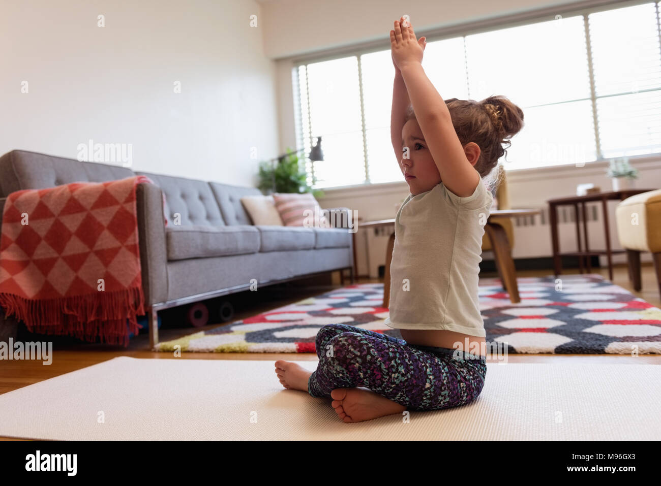 Girl yoga pose in hi-res stock photography and images - Alamy