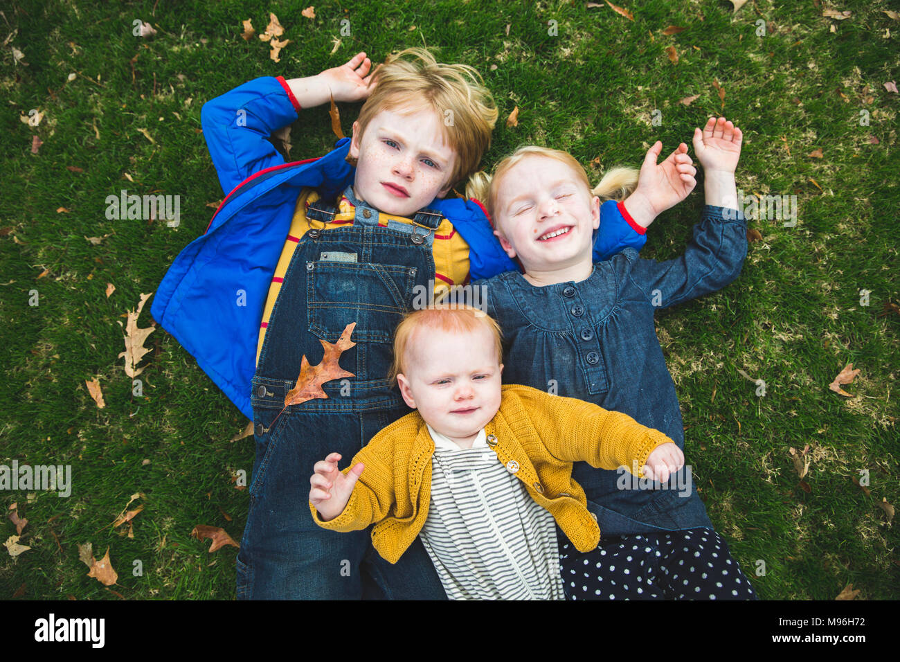 Boy girl laying down on hi-res stock photography and images - Alamy