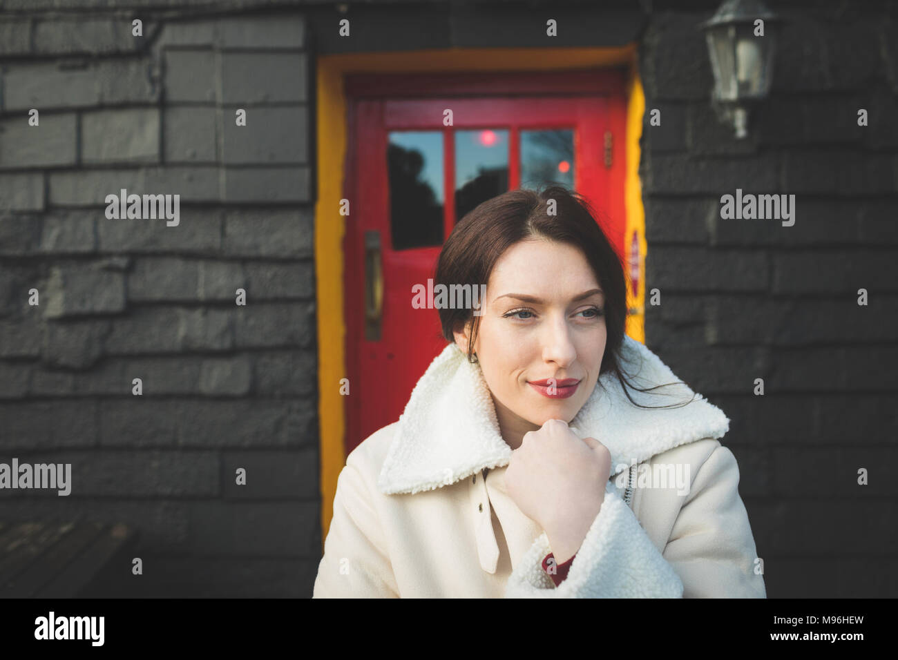 Woman standing front house hi-res stock photography and images - Alamy