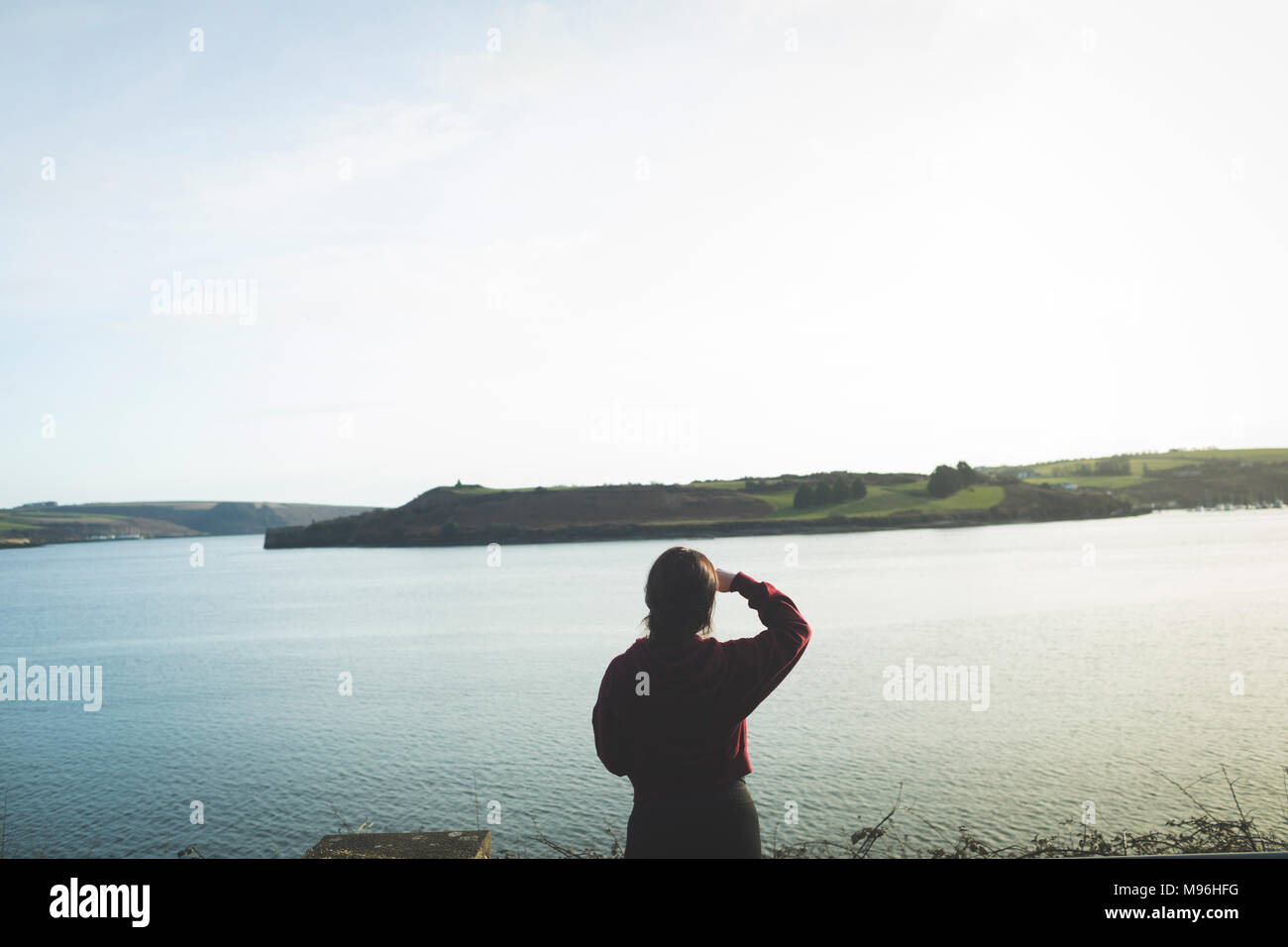 Woman standing by river hi-res stock photography and images - Alamy