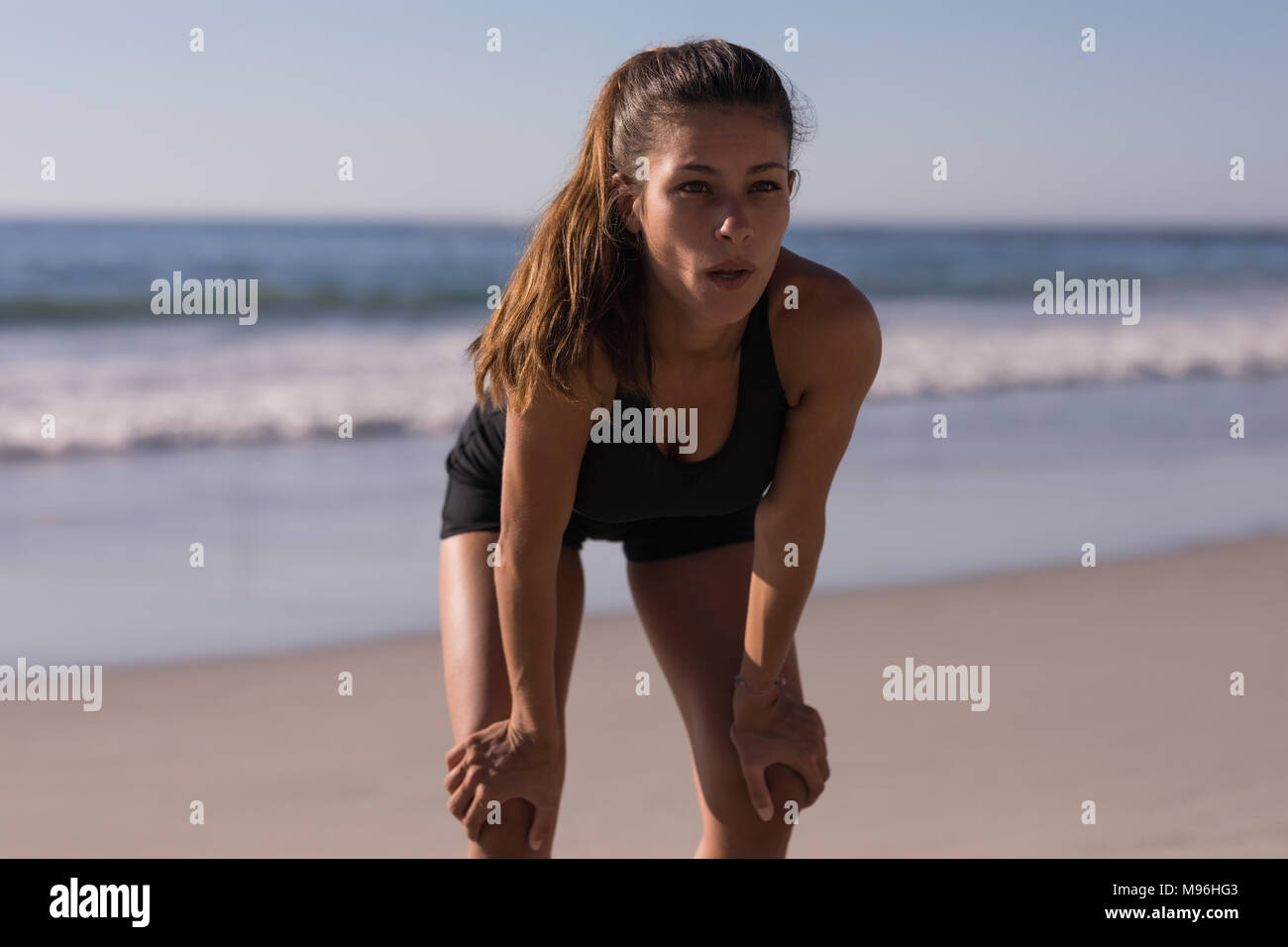 Tired woman taking break in the beach Stock Photo - Alamy