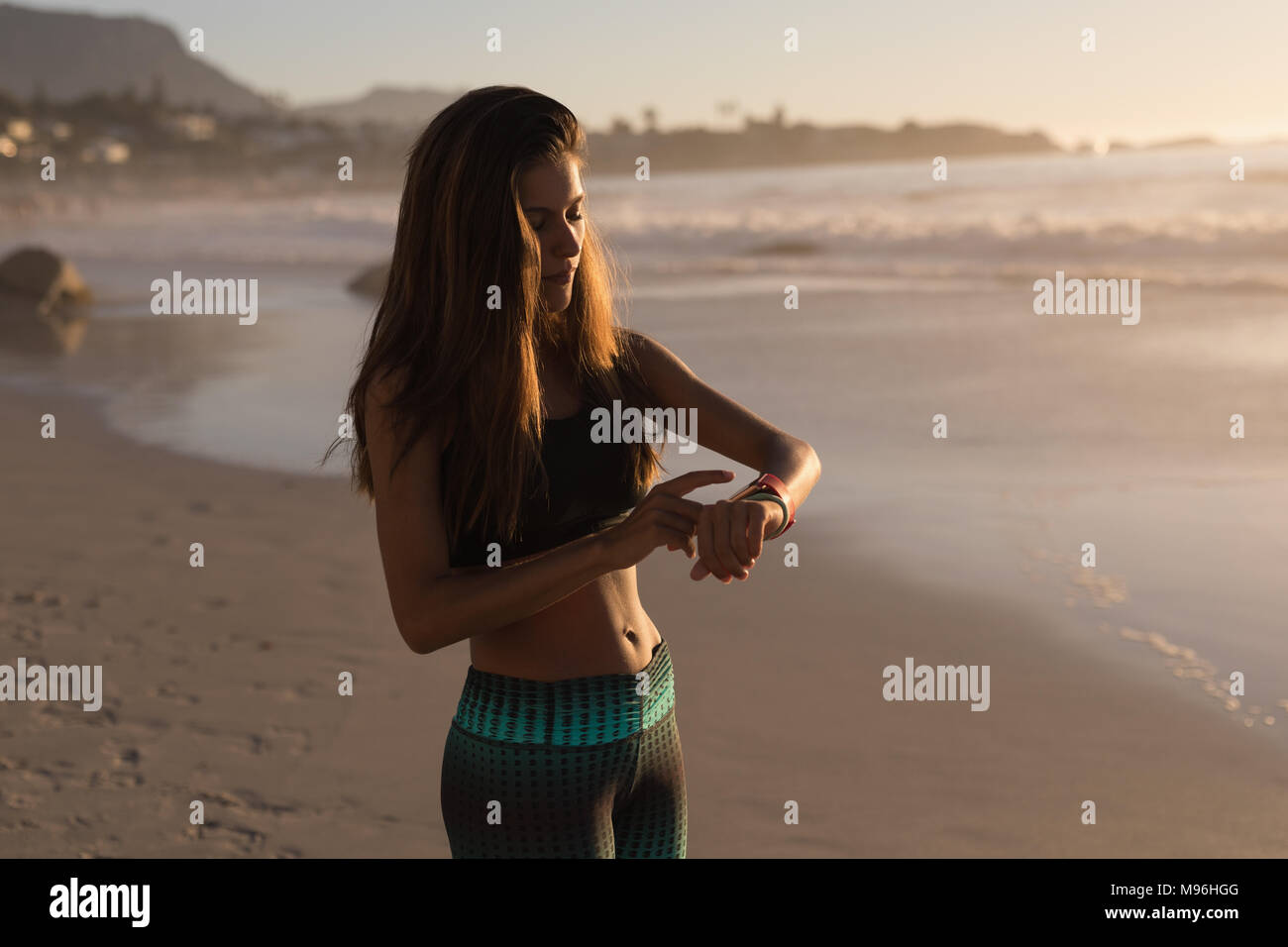 Pretty woman smartwatch standing in hi-res stock photography and images ...