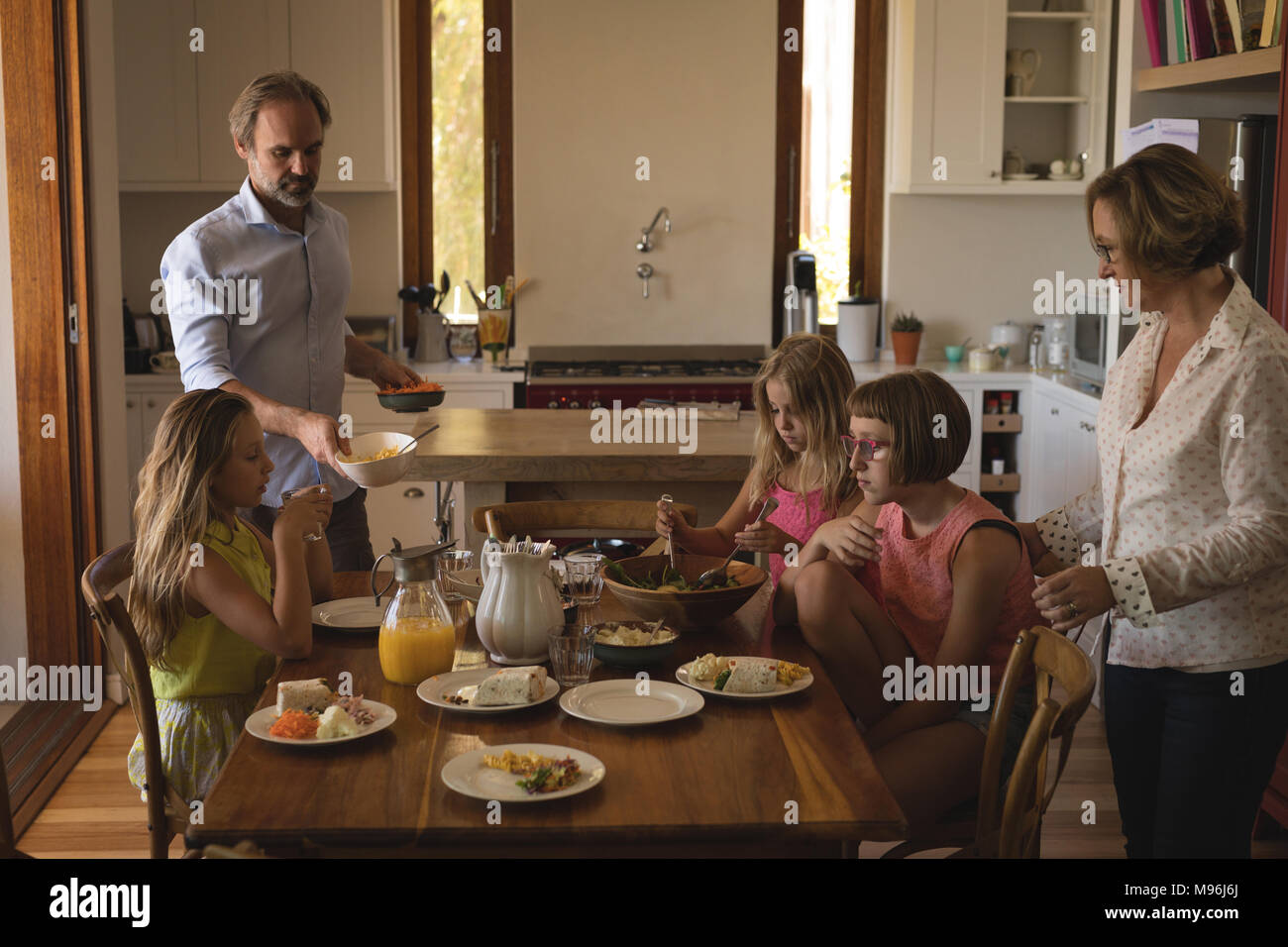 His family having lunch hi-res stock photography and images - Alamy