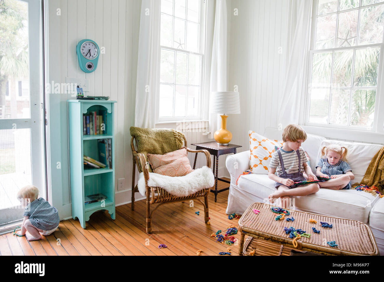 Boy girl sitting on couch hi-res stock photography and images - Alamy