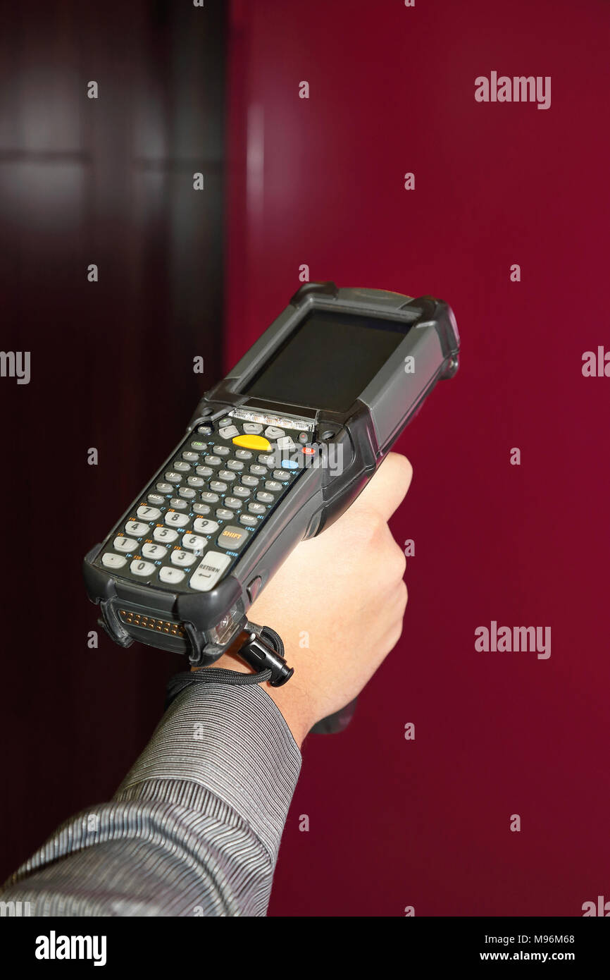 Shipping Worker Holding Handheld Barcode Reader Stock Photo - Alamy