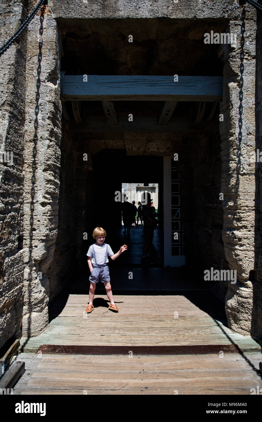 Boy standing underneath fort Stock Photo - Alamy