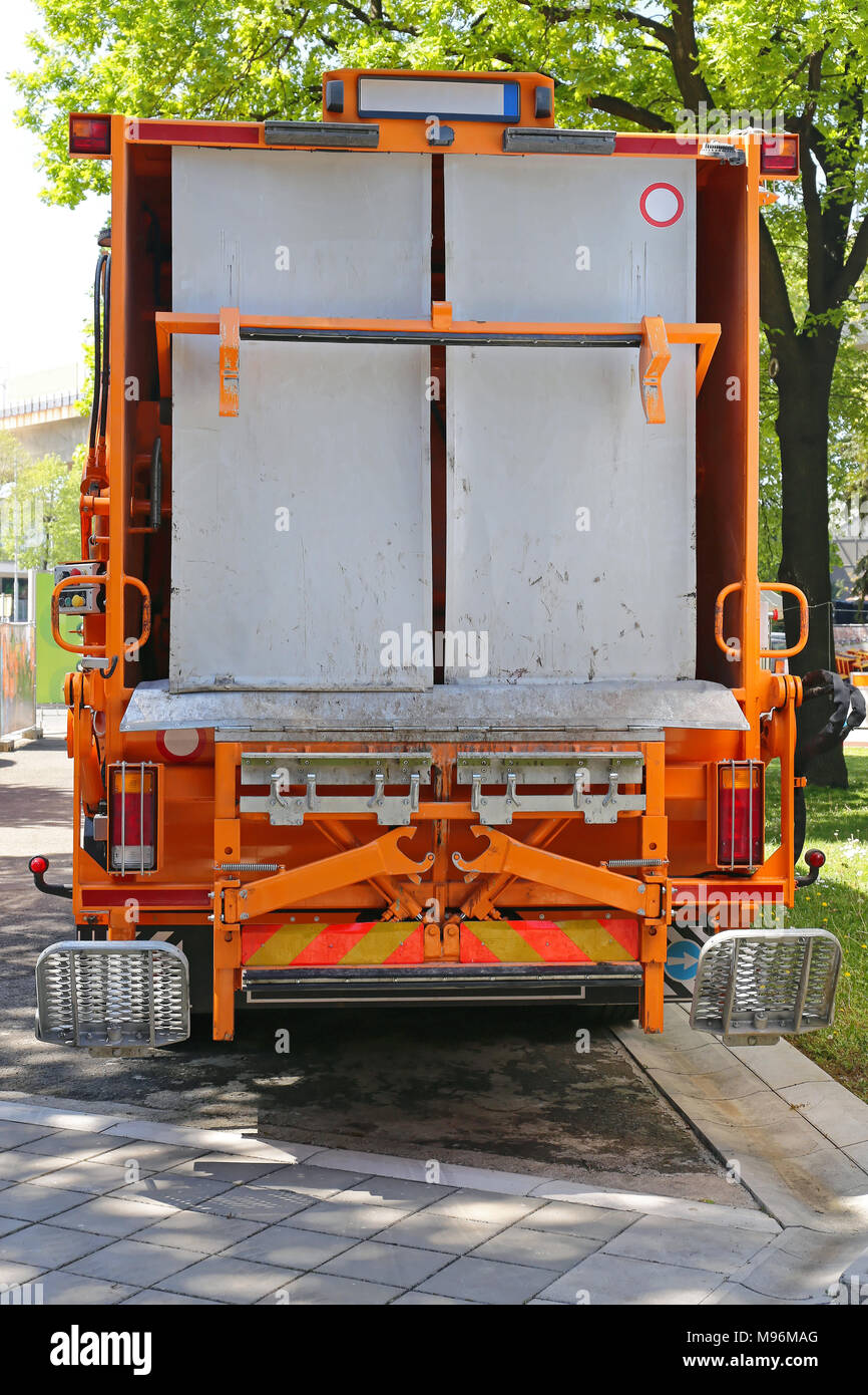 Waste Collection Loader at Rear of Garbage Truck Stock Photo - Alamy