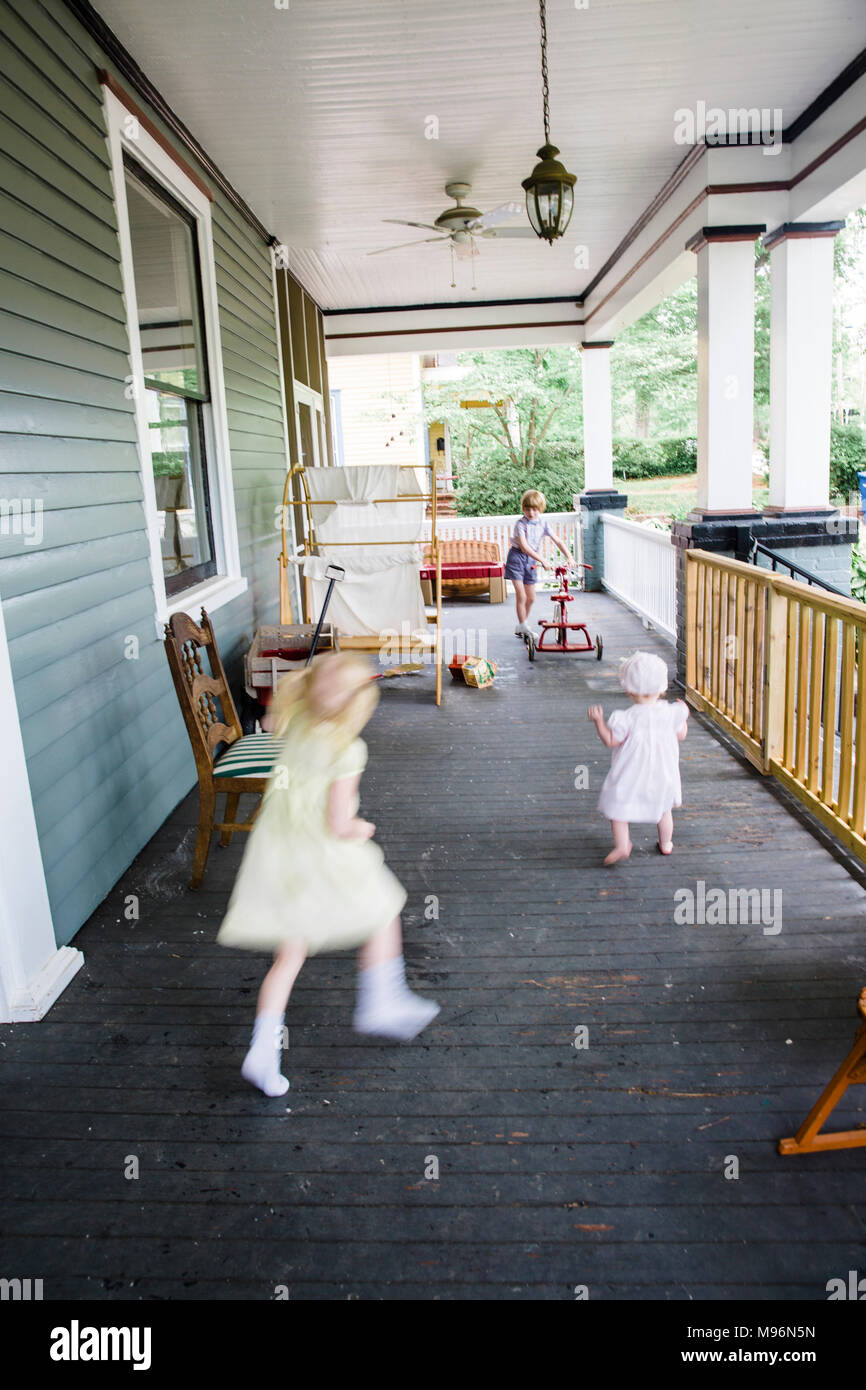 Children playing on porch Stock Photo - Alamy