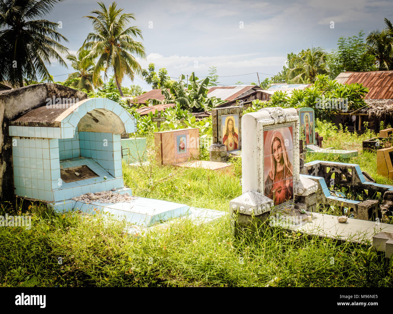 An old, idyllic tropical graveyard in Flores Island, Lesser Sunda ...