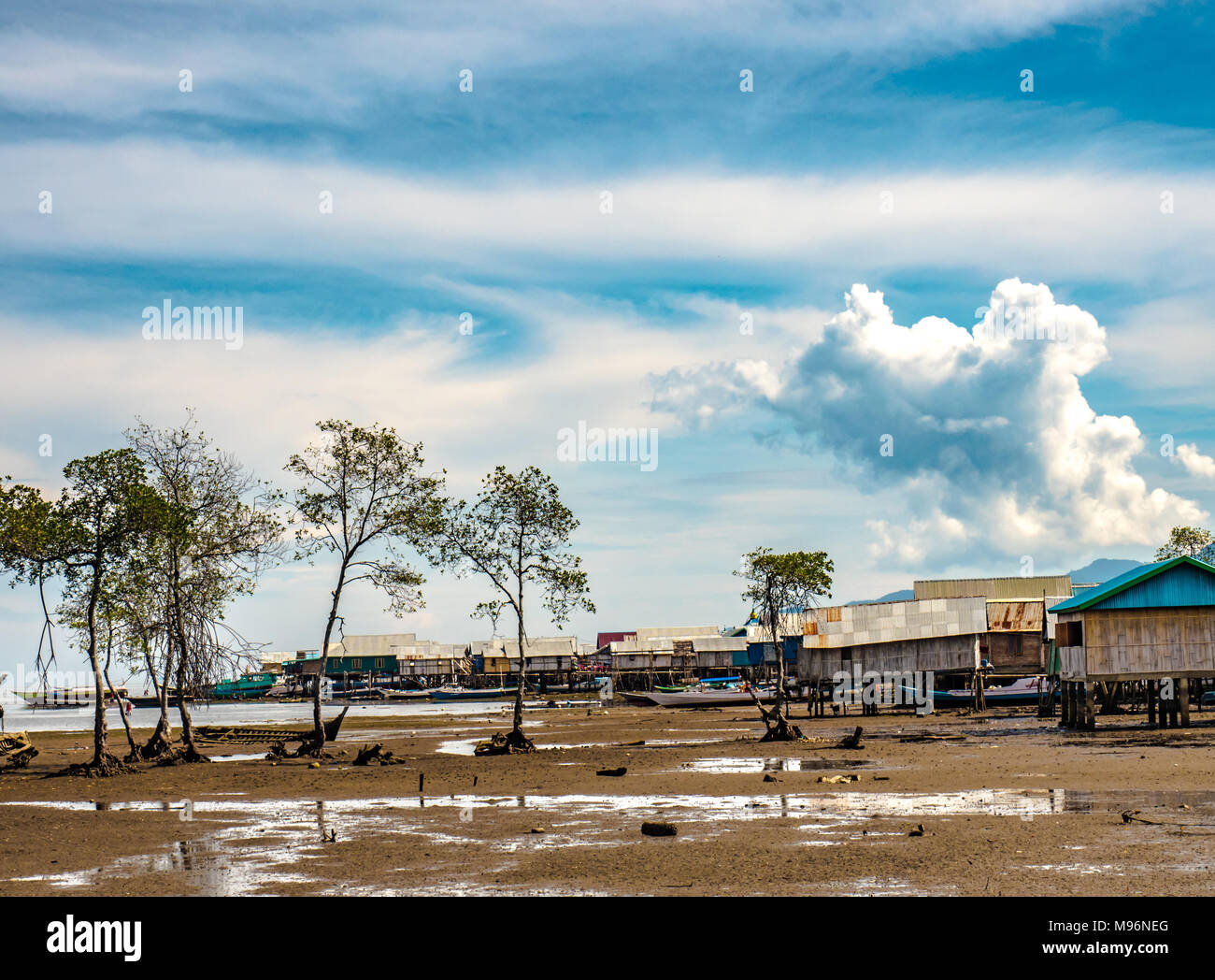 Village of Sea Gypsies during low tide. Asian traditional wooden houses ...