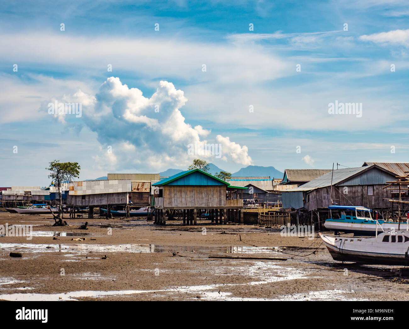 Village of Sea Gypsies during low tide. Asian traditional wooden houses ...