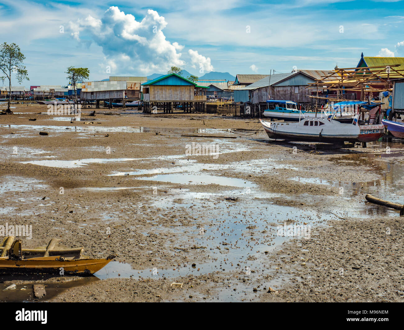 Village of Sea Gypsies during low tide. Asian traditional wooden houses ...