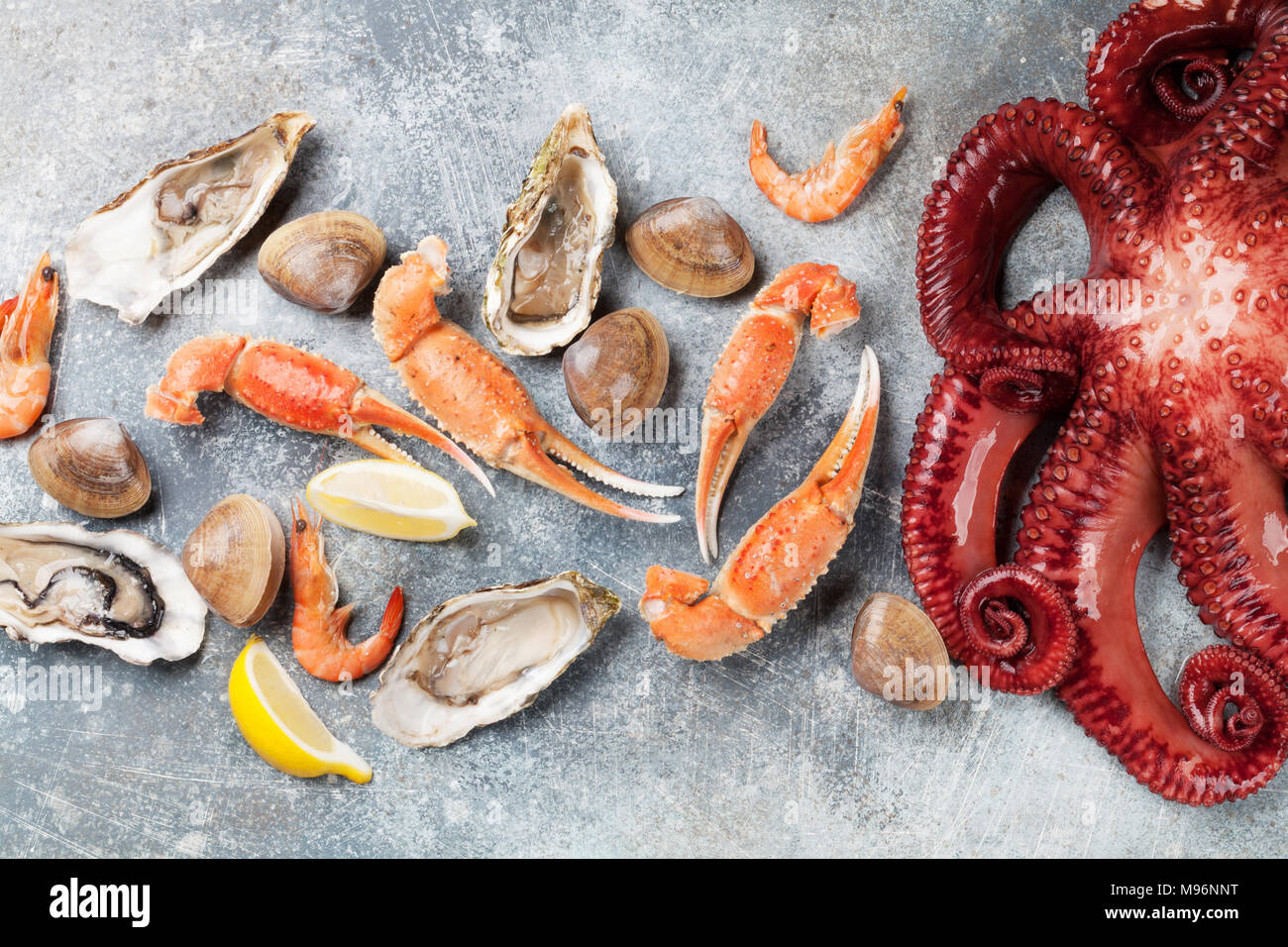 Seafood. Octopus, oysters, lobster, shrimps, clams cooking. Top view ...