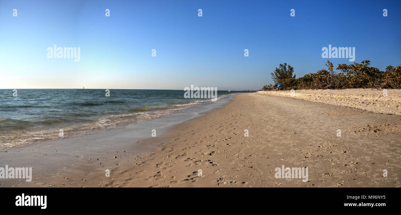 White sand beach of Delnor-Wiggins Pass State Park with a blue sky ...