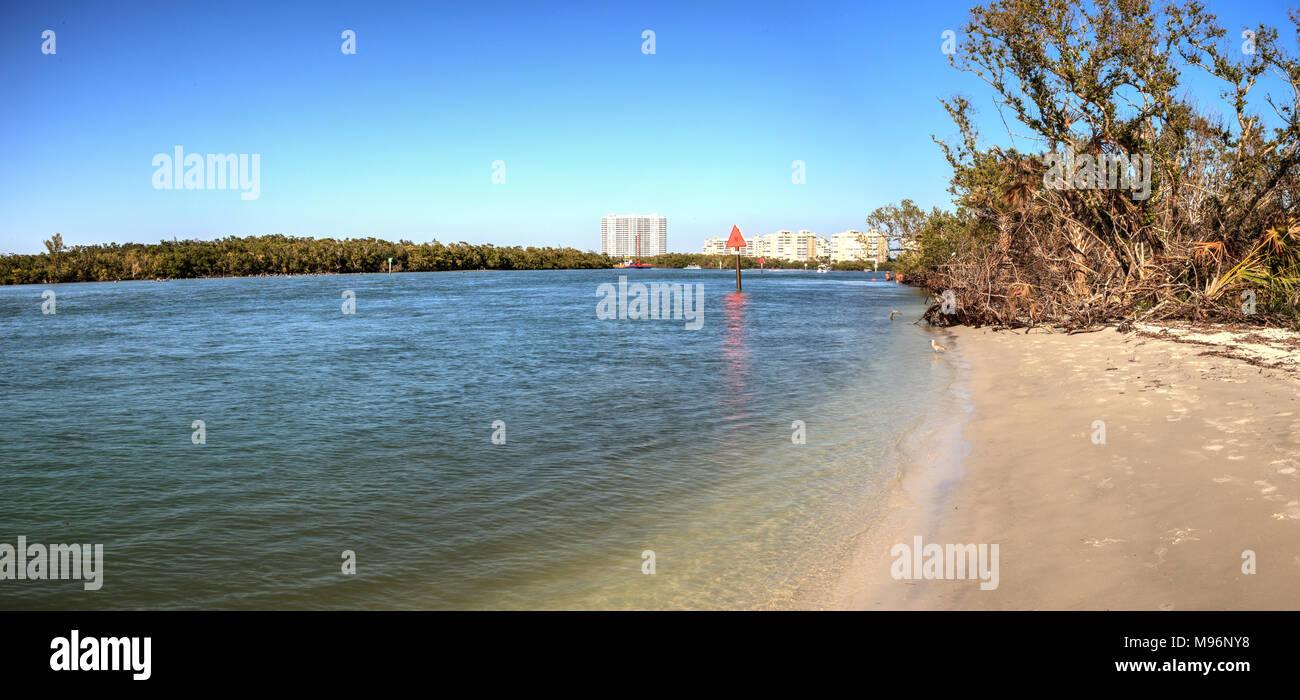 White sand beach of Delnor-Wiggins Pass State Park with a blue sky ...