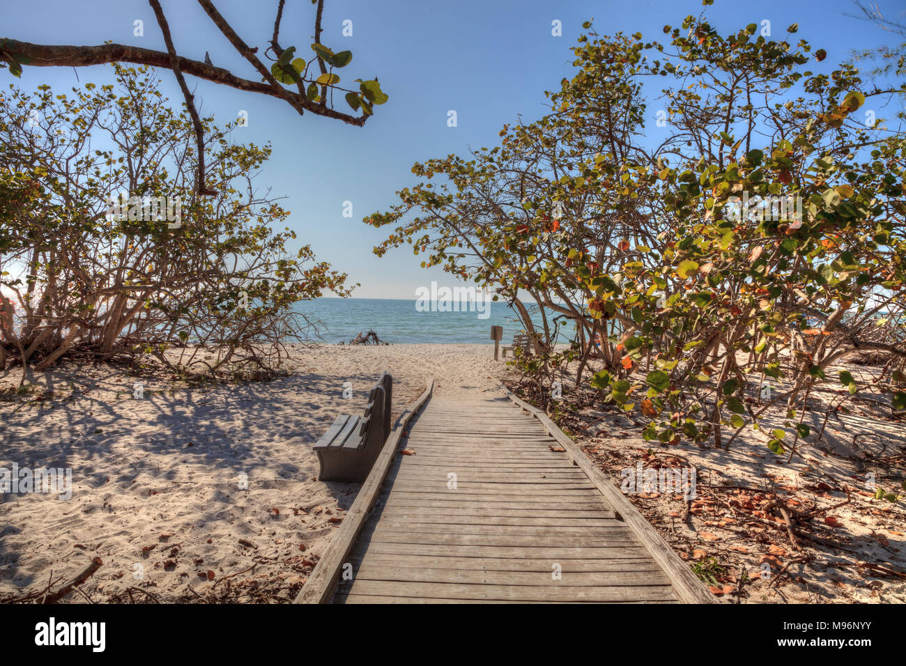 Boardwalk across the white sand beach of Delnor-Wiggins Pass State Park ...