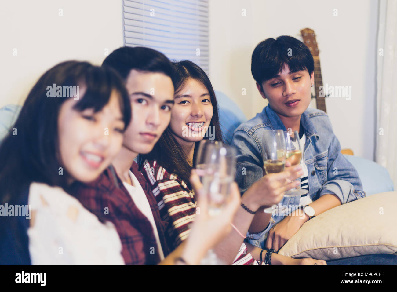 Asian group of friends having party with alcoholic beer drinks and ...