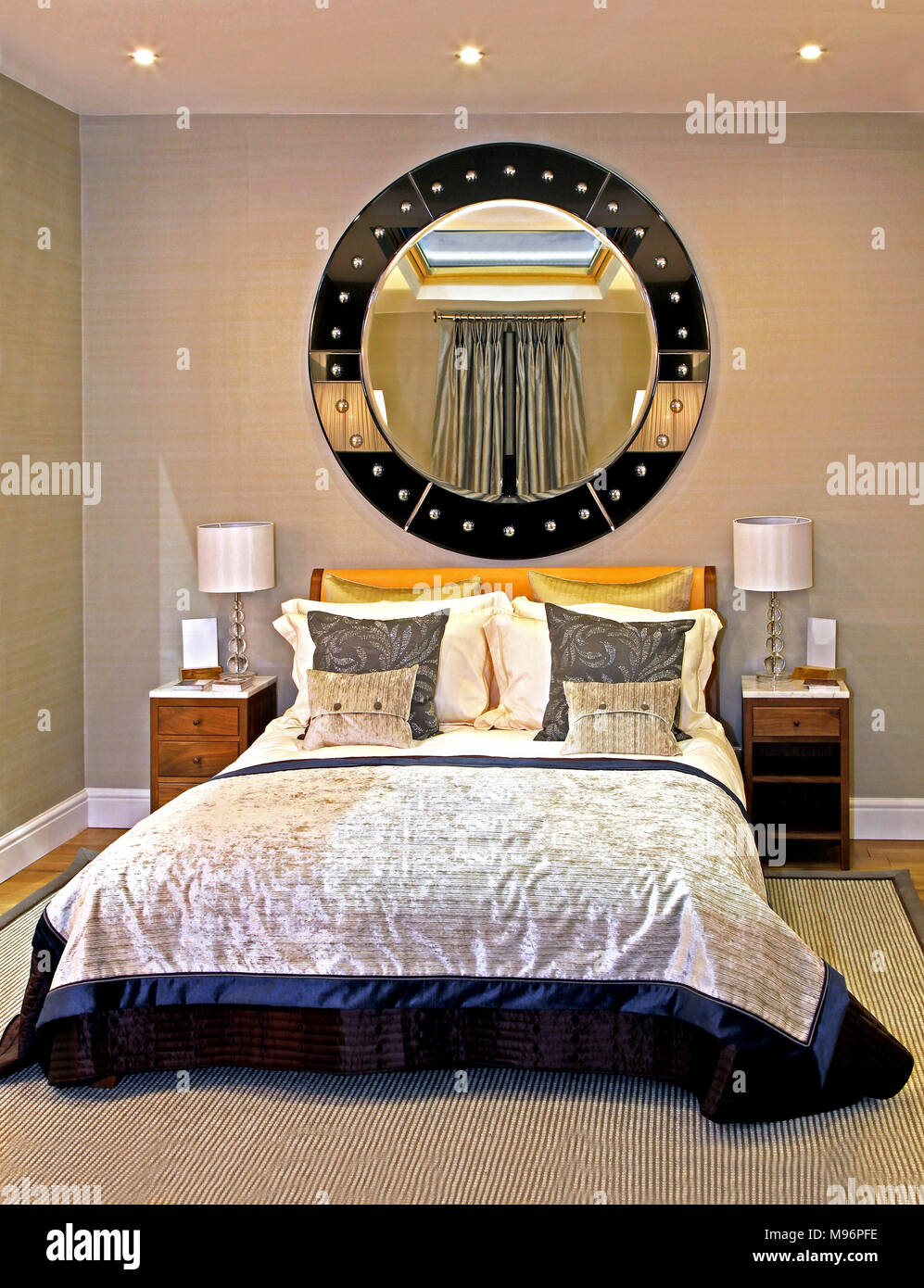 Modern bedroom interior with big double bed Stock Photo - Alamy