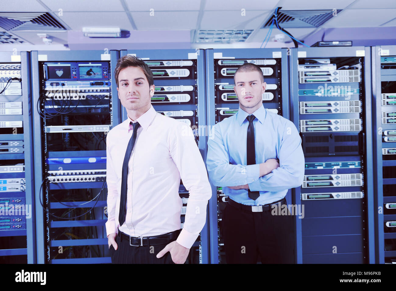 group of young business people it engineer in network server room ...