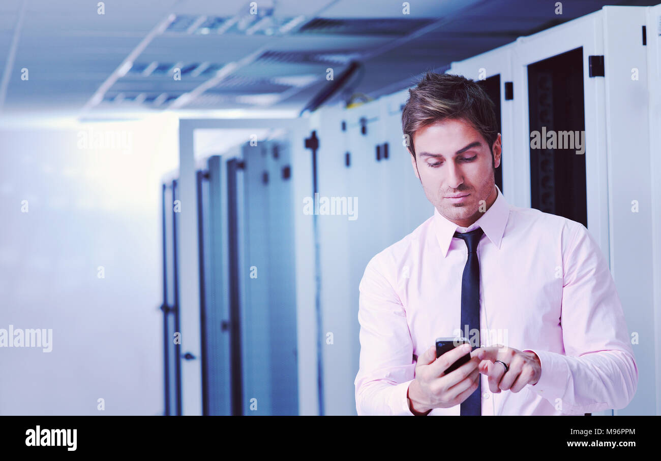 young business man computer science engeneer talking by cellphone at ...