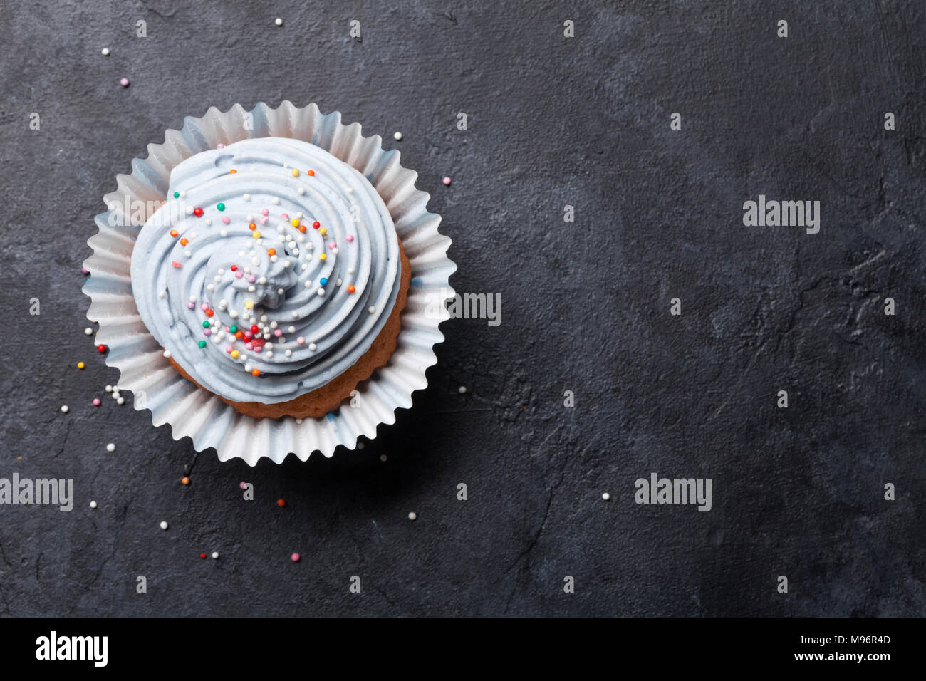 Sweet cupcake with colorful decor. Top view with space for your ...