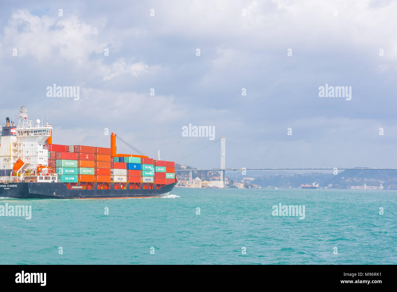 Huge Cargo ship tanker or container passes under 15 July Martyrs Bridge ...