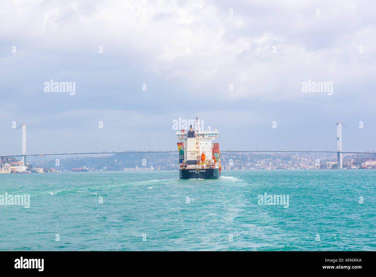 Huge Cargo ship tanker or container passes under 15 July Martyrs Bridge ...