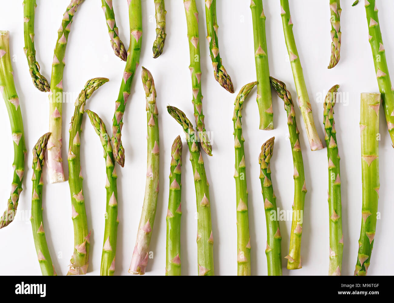 Background from isolated on white background asparagus. Top view Stock ...