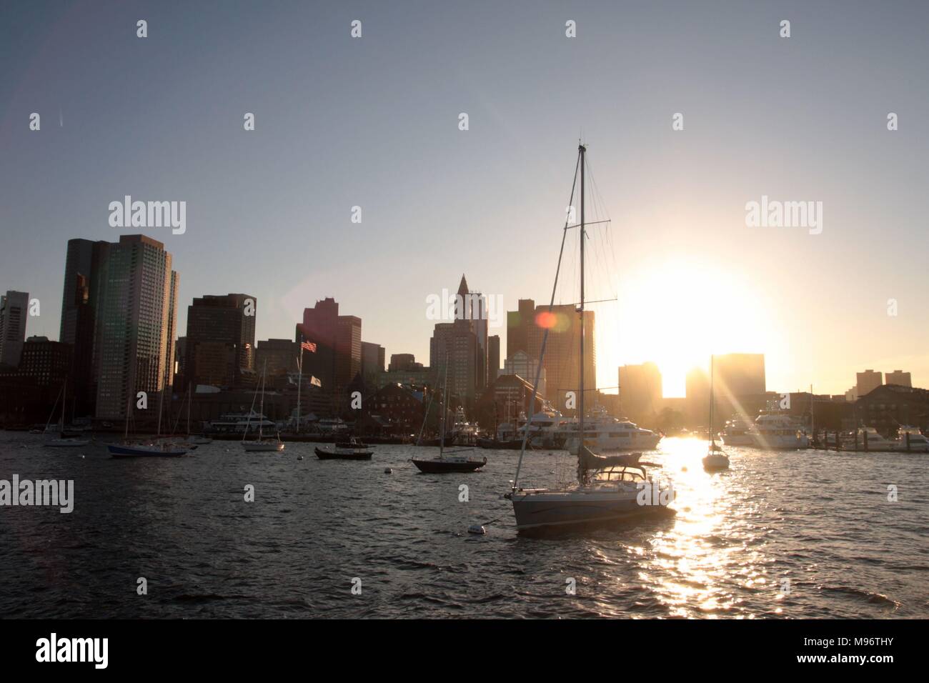 Boston skyline at sunset during a cruise in the bay Stock Photo - Alamy