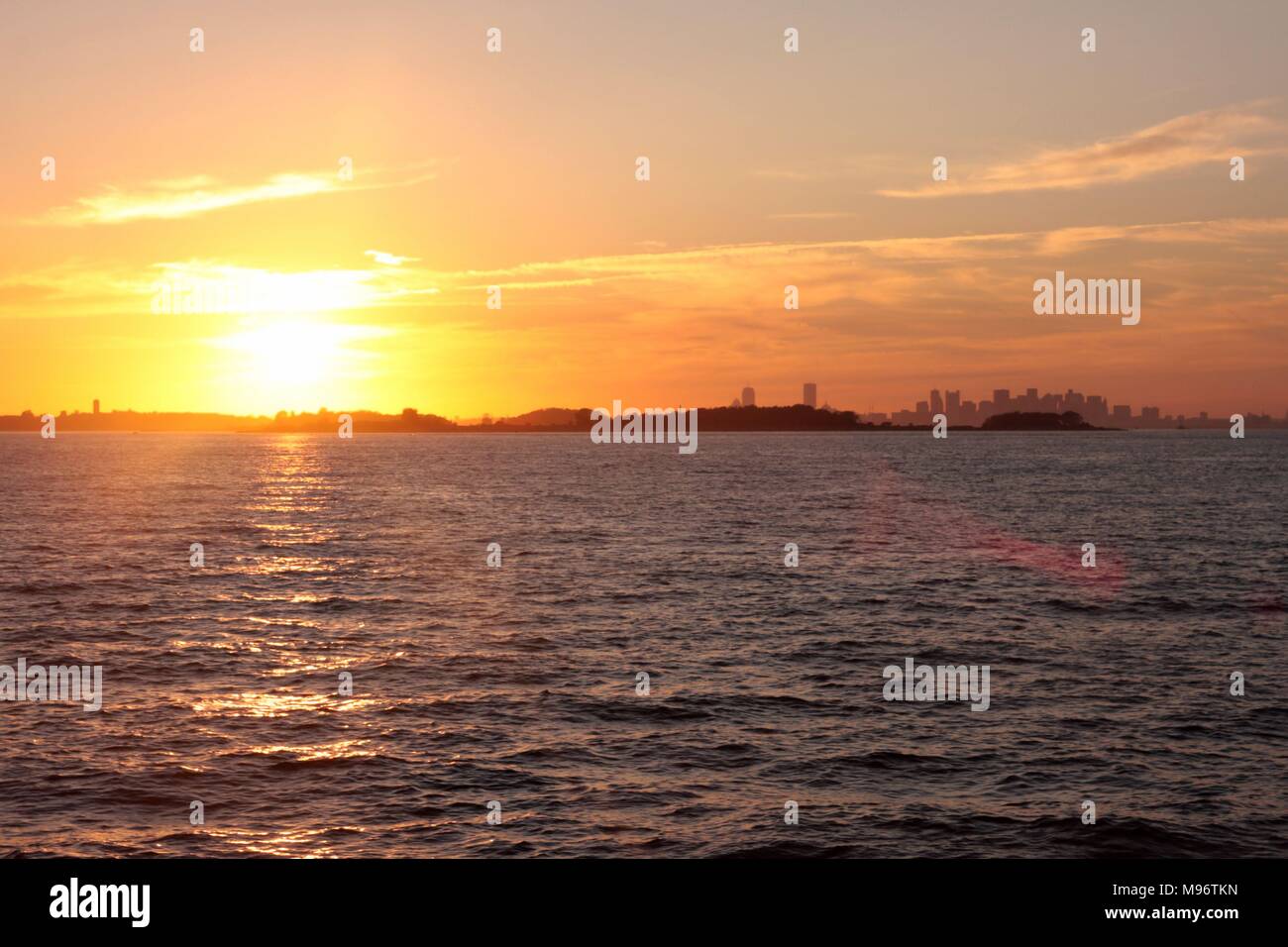 Boston skyline at sunset during a cruise in the bay Stock Photo - Alamy
