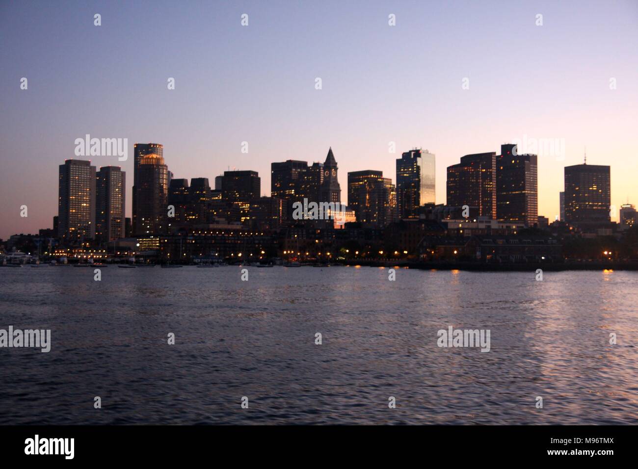 Boston skyline at sunset during a cruise in the bay Stock Photo - Alamy