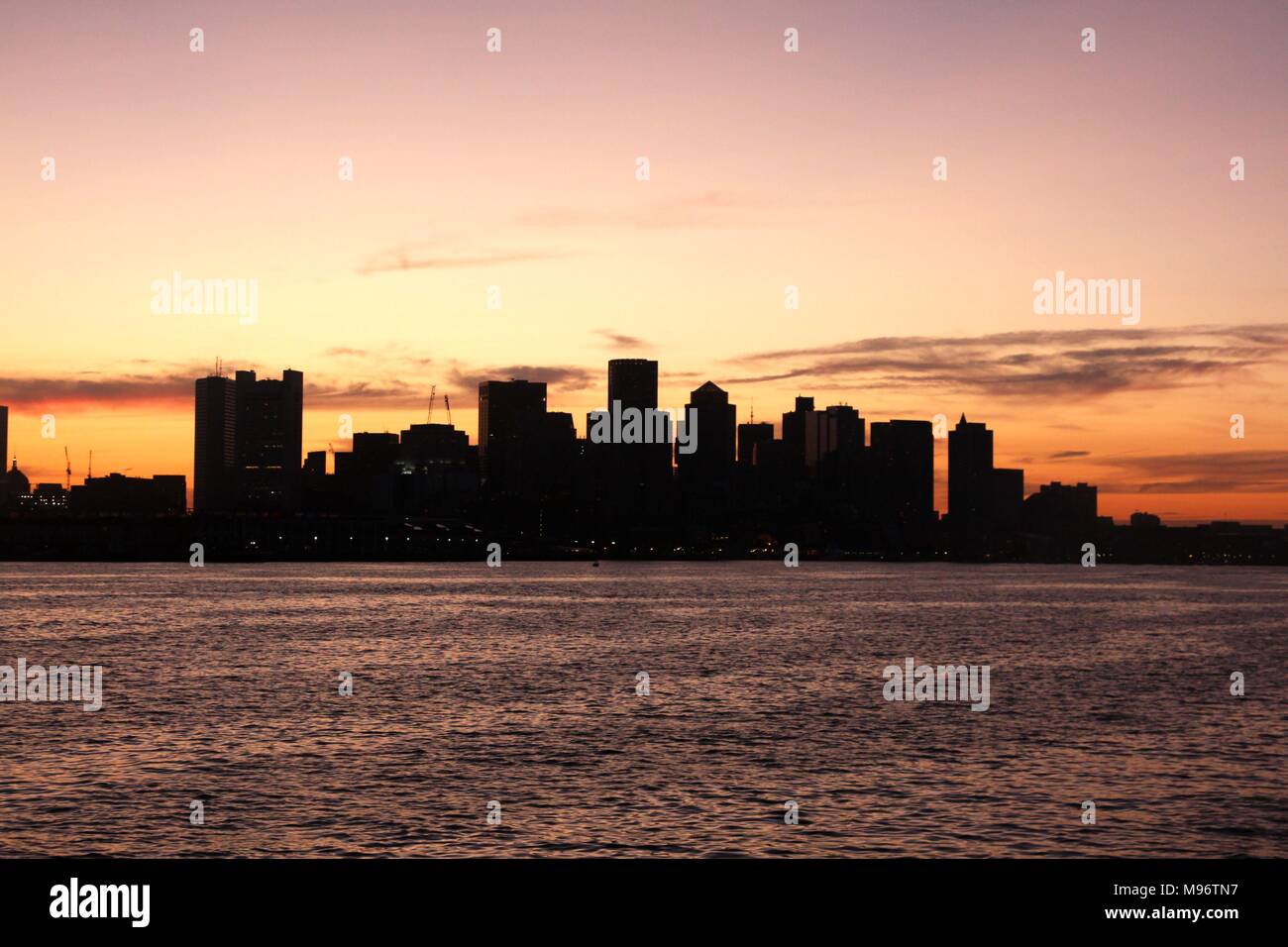 Boston skyline at sunset during a cruise in the bay Stock Photo - Alamy