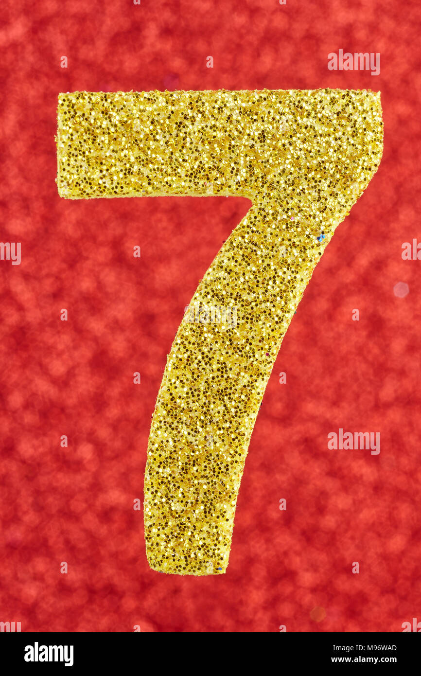 Number seven golden color over a red background. Anniversary. Vertical ...