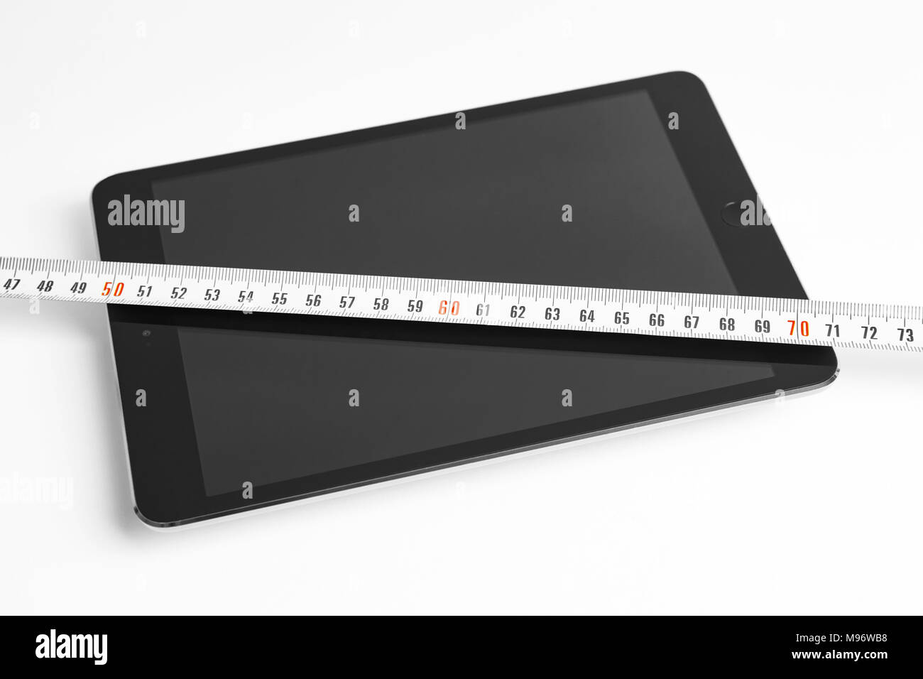 Tablet and tape measure. Isolated on white. Construction design ...