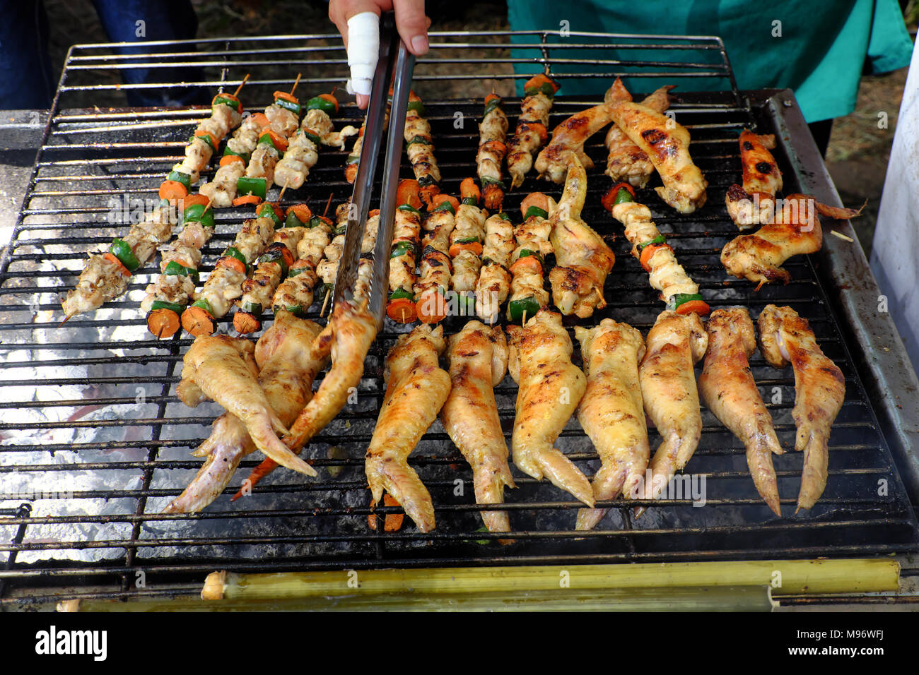 Barbecued food at Ho Chi Minh city, Vietnam, grill chicken wings on ...