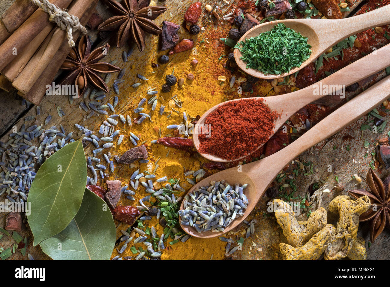 Herbs and Spices on a rustic farmhouse table. Used to add flavor and ...
