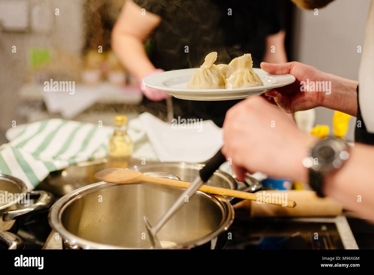 Cooking khinkali in boiling water hi-res stock photography and images ...