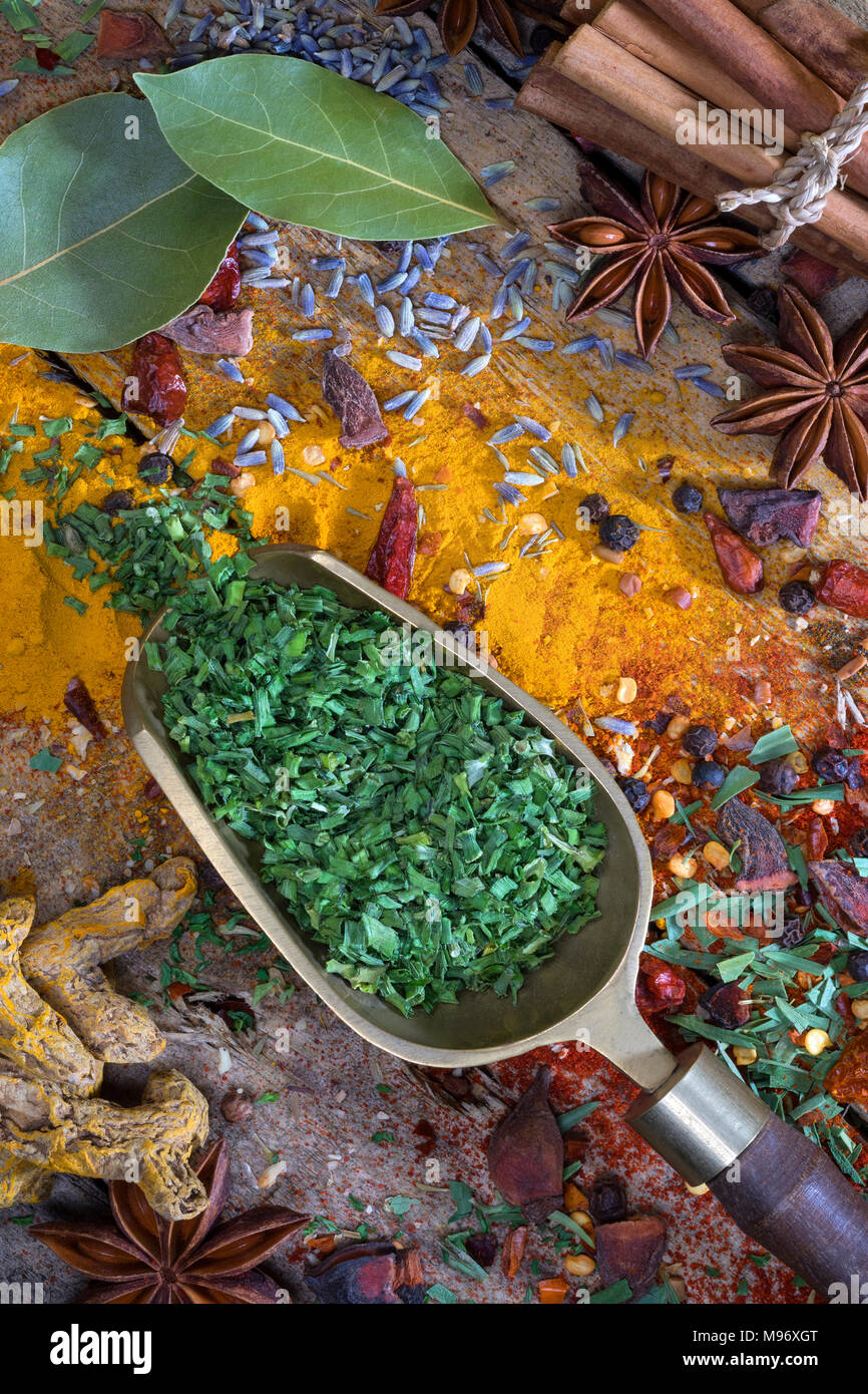 Herbs and Spices on a rustic farmhouse table. Used to add flavor and ...