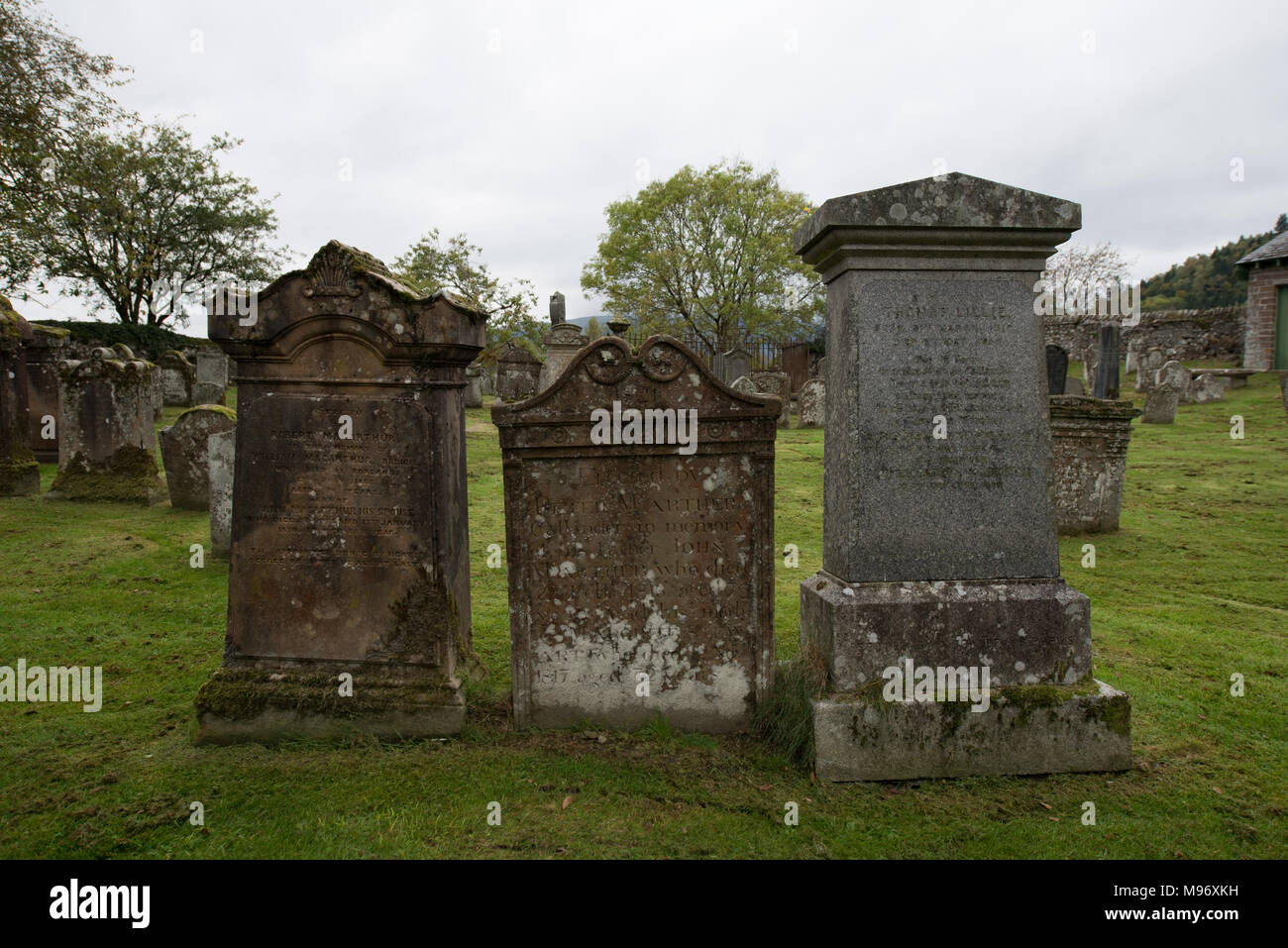 Three gravestones in a graveyard in Scotland Stock Photo - Alamy