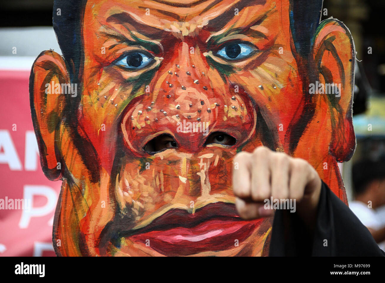 Manila, Philippines. 23rd March, 2018. A protester wearing a President ...